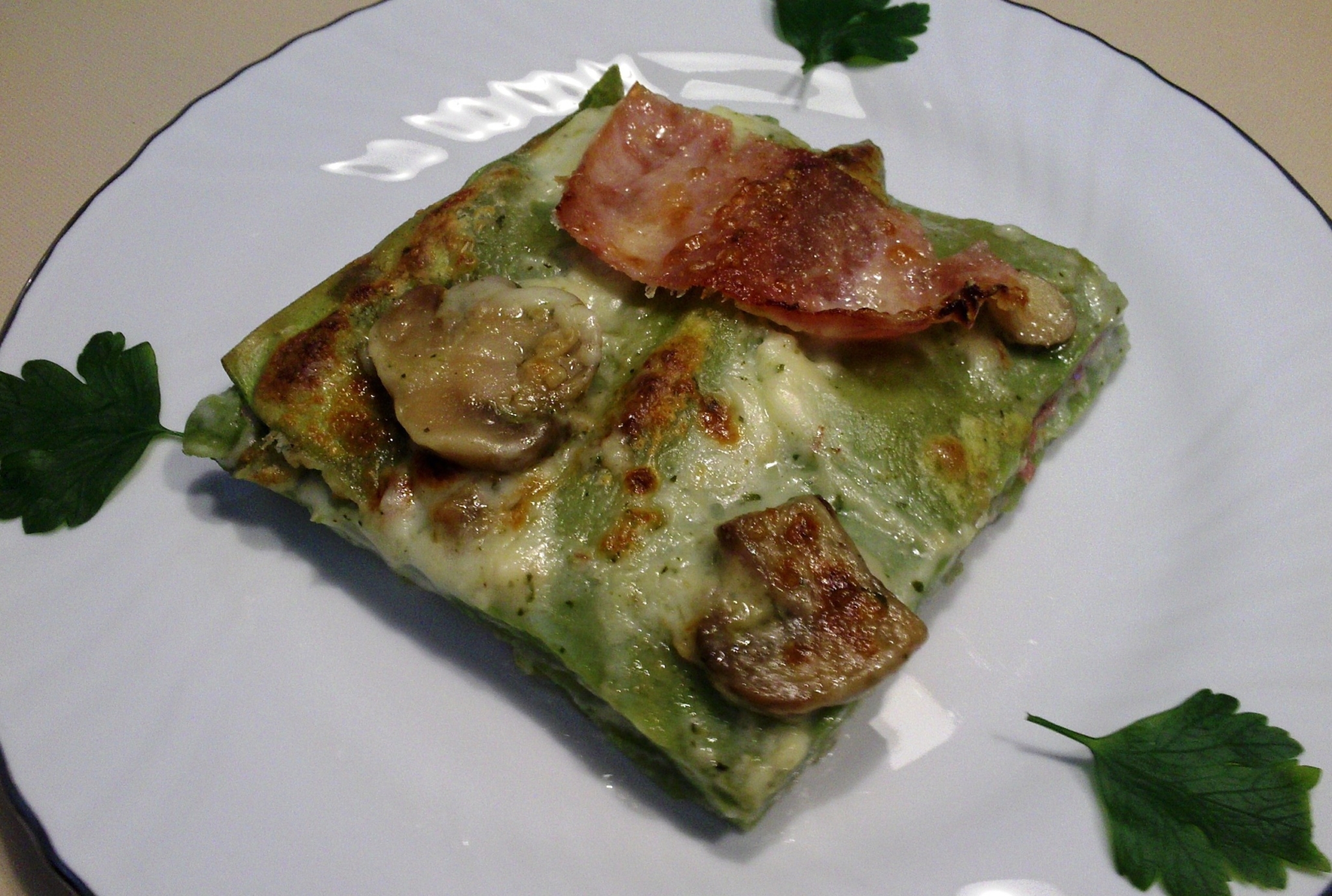 Lasagne verdi al forno con prosciutto e funghi - I viaggi del Goloso